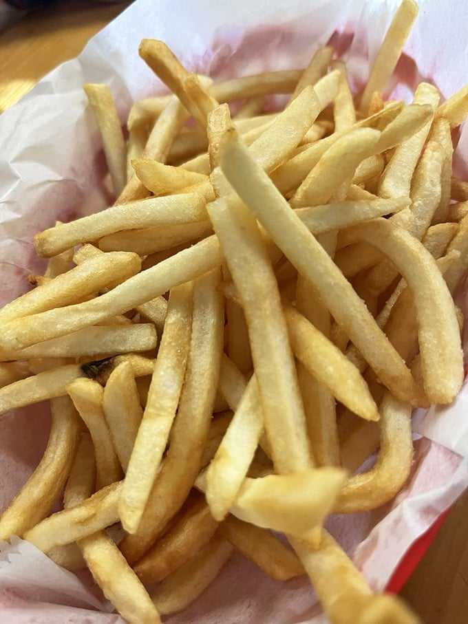French fries done right—golden, crisp, and plentiful. Not those skimpy, sad excuses for potatoes that some places try to pass off.