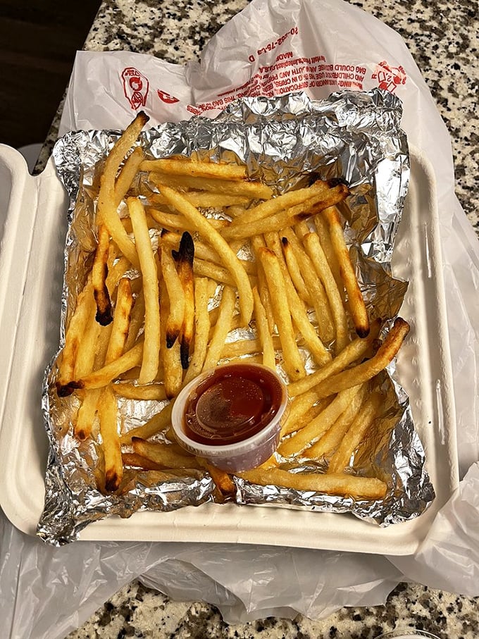 Fries that achieve that mythical balance—crispy exterior, fluffy interior—served with a side of ketchup and happiness.