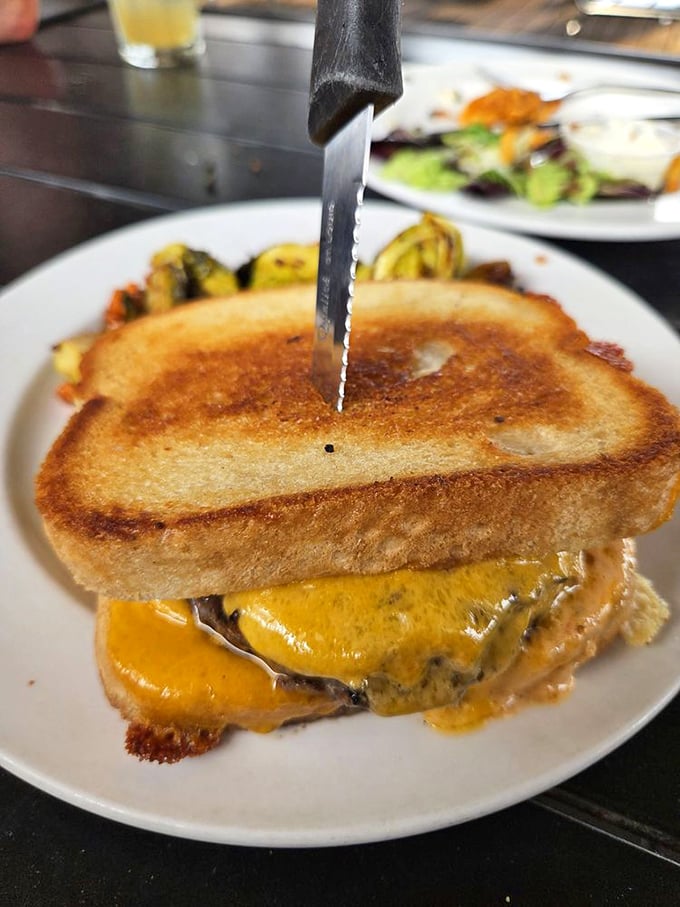 This grilled cheese sandwich has clearly been working out—bulging with melted cheddar and attitude, it's comfort food with ambition.