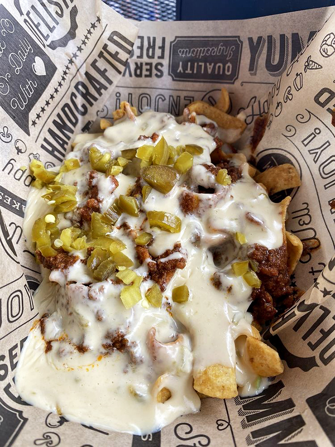 The Frito Pie transforms humble corn chips into a delivery system for layers of chili, cheese, and jalapeños—proof that greatness often comes in simple packages.