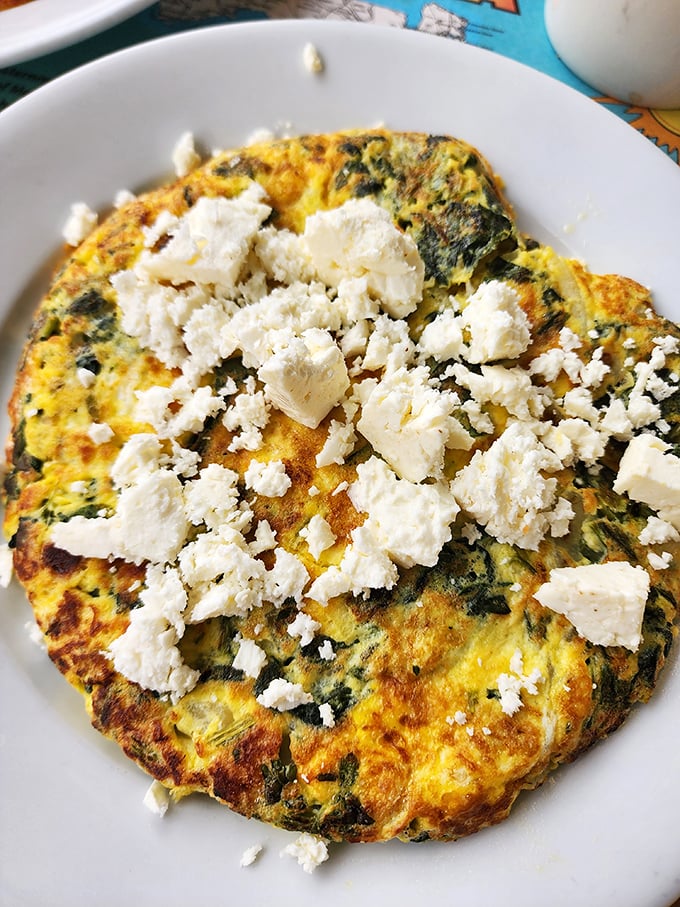 A spinach and feta frittata that would make any Greek grandmother nod in approval—hearty, fluffy, and unapologetically delicious.