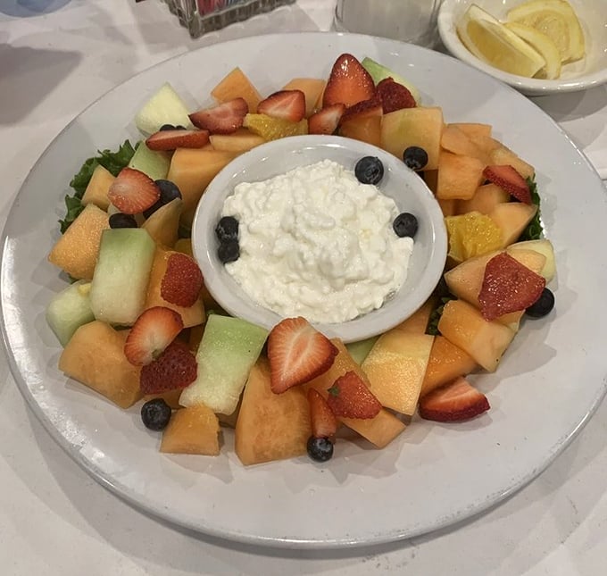 This fruit platter with cottage cheese center isn't just breakfast—it's edible art that somehow makes healthy eating feel like cheating.
