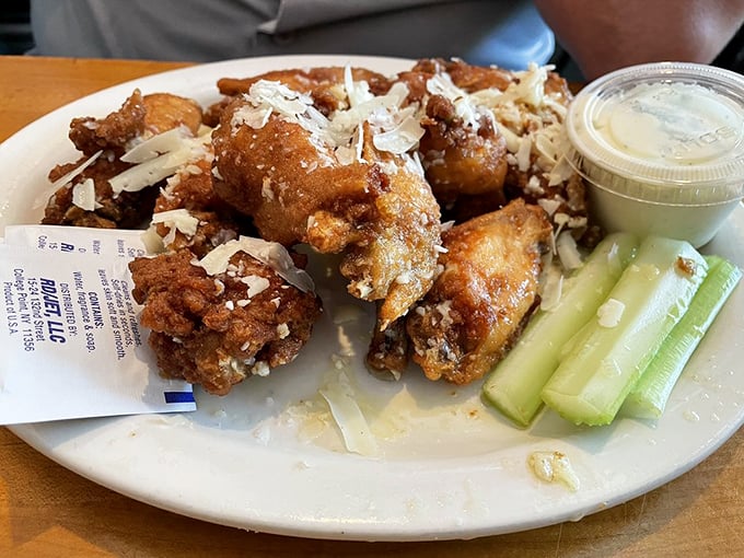 Golden wings dusted with garlic and parmesan magic that'll have you licking your fingers without shame.