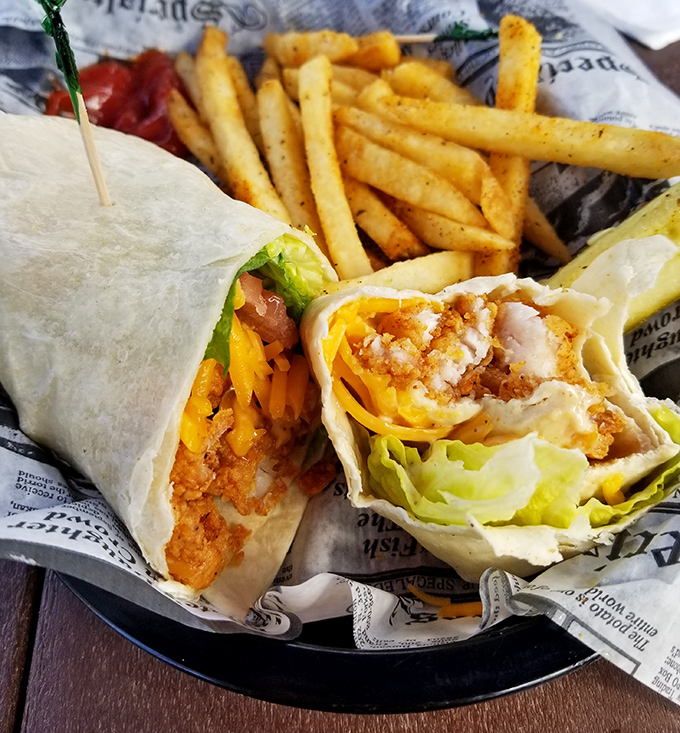 This wrap isn't just a meal, it's a portable feast. Crispy protein, fresh veggies, and cheese bundled together like a delicious care package.