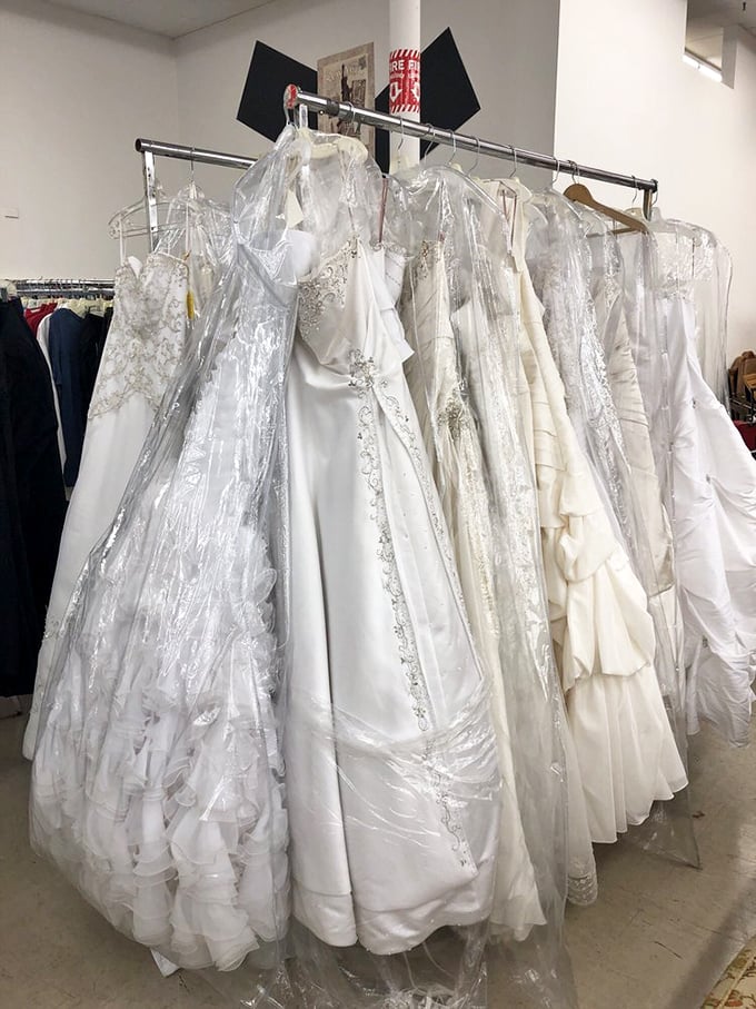 Wedding gowns await second chances at happily-ever-after, their crystalline details and satin folds whispering of celebrations past.