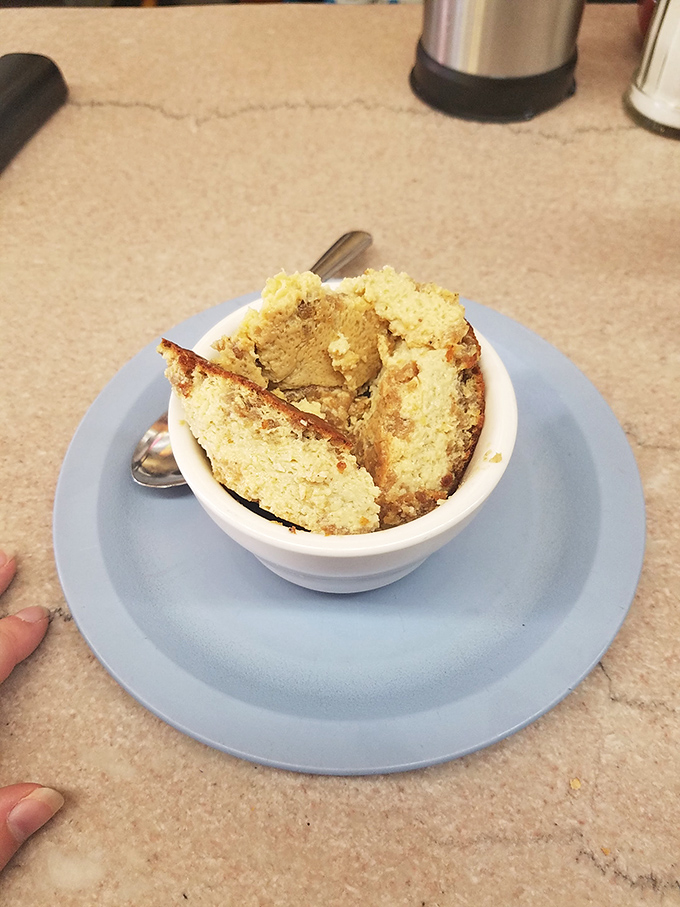 Grapenut pudding – a New England classic that bewilders outsiders but comforts locals, sweet nostalgia served in a simple white bowl.