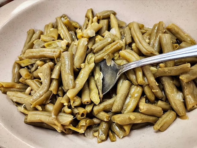 These aren't your cafeteria green beans—they've slow-danced with pork and seasonings until they've reached vegetable nirvana.