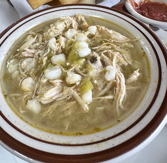 The green chile chicken posole offers tender shredded meat and hominy swimming in a broth so flavorful you'll want to request it by IV drip.