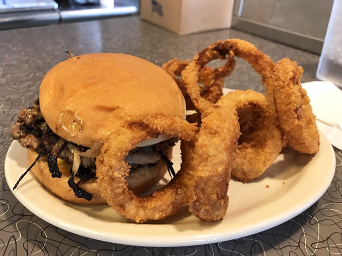 When a burger meets onion rings, it's not just a meal—it's a relationship worth committing to. Till the last bite do you part.