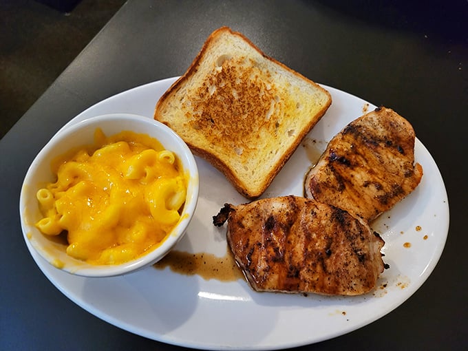 When pork chops meet mac and cheese, it's not just dinner—it's proof that soulmates exist on the same plate.