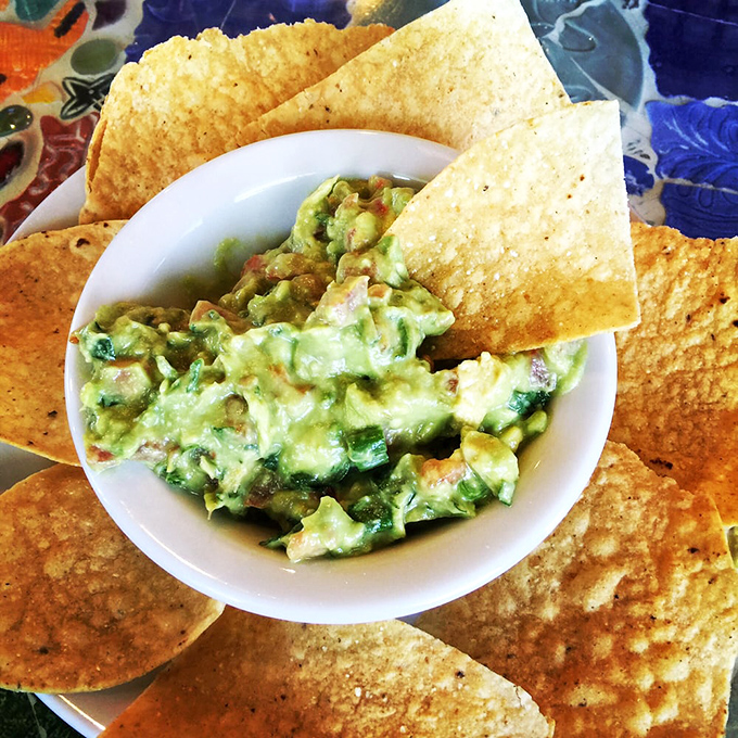 Guacamole so fresh it practically photosynthesizes. Those chips aren't just dippers—they're the chosen vessels for green gold.