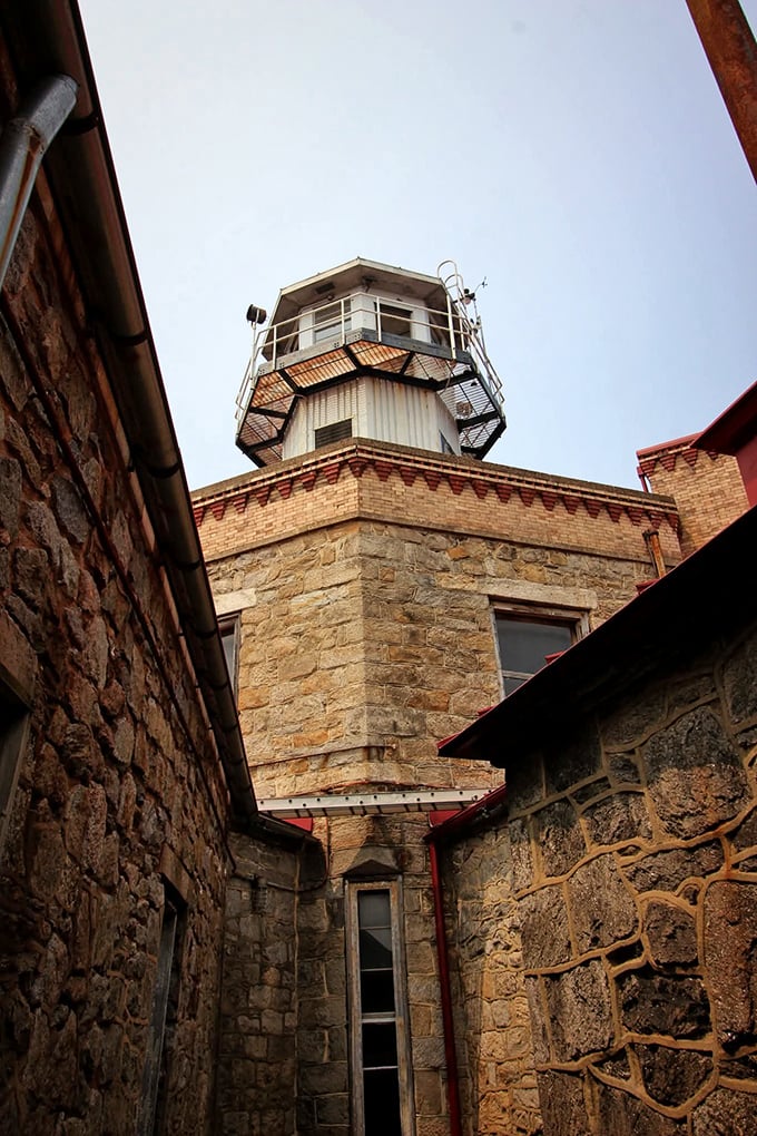 Looking up at the guard tower from the yard, you can almost hear the echoing footsteps of officers patrolling these stone corridors.