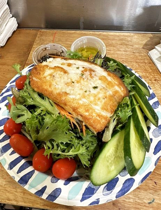 Even salads get the star treatment here—this halibut fillet perched atop fresh greens is proof that "eating light" doesn't mean sacrificing flavor or satisfaction.