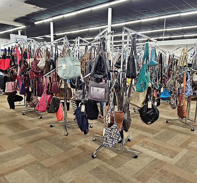 Handbag heaven! Designer lookalikes and genuine finds hang in organized splendor, waiting to become your next favorite accessory without breaking the bank.