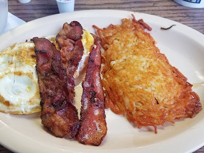 Crispy bacon, sunny eggs, and hash browns with the perfect crunch – breakfast doesn't get more honest than this plate of morning glory.