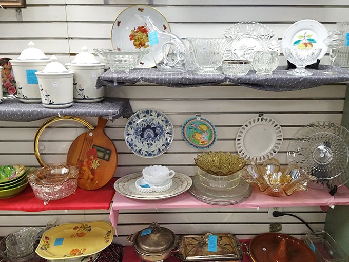Glassware that tells stories of dinner parties past. One person's retired entertaining set becomes another's vintage collection—circle of retail life.