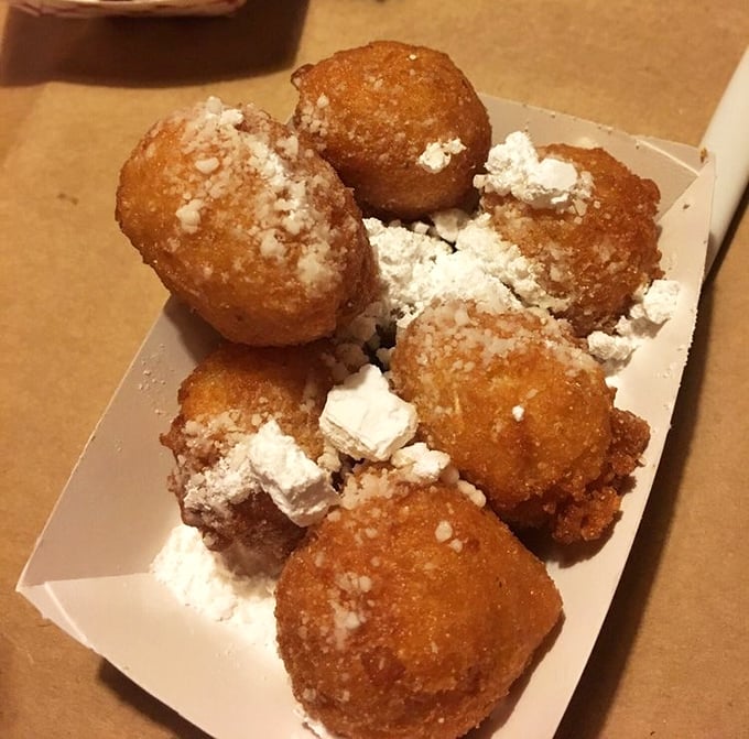 Hush puppies dusted with powdered sugar—a sweet-savory contradiction that somehow makes perfect sense after your first bite.