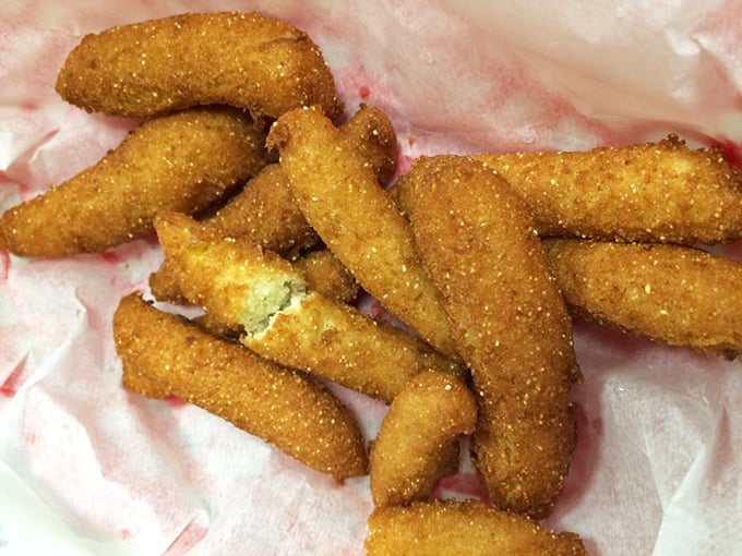 Hush puppies golden as sunrise, crisp as autumn leaves – these cornmeal treasures are the supporting actors that sometimes steal the barbecue show.