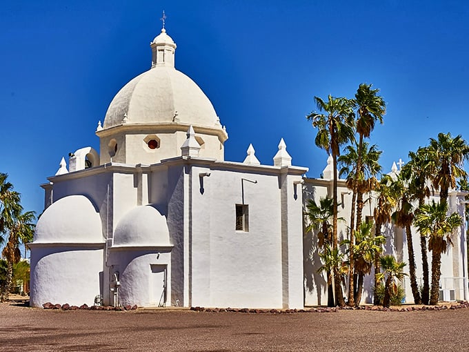 The church's brilliant white dome and walls practically glow against the desert sky, creating the kind of lighting photographers wake up at 5 a.m. hoping to capture.