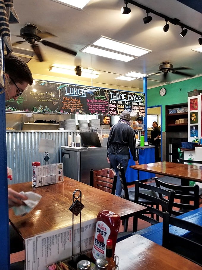 The chalkboard menu tells tales of culinary possibilities while diners plot their next flavor adventure in this cozy corner of breakfast paradise.