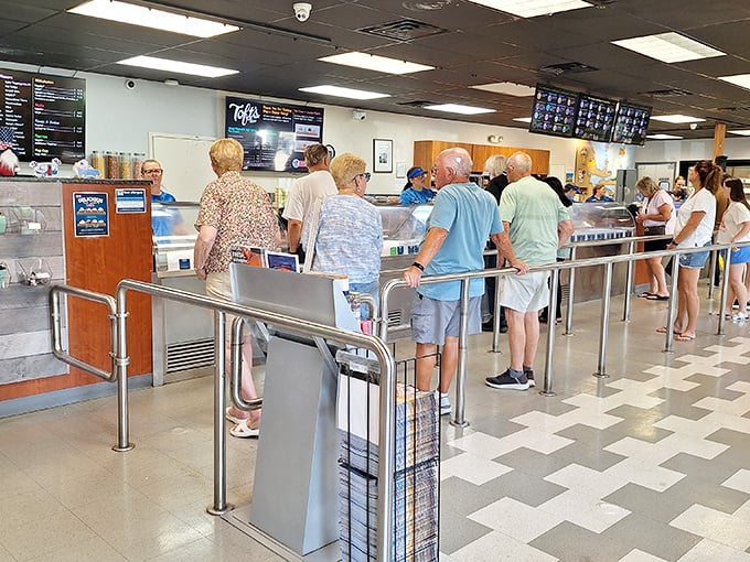 The line forms with purpose and anticipation—strangers united by the universal language of "I need exceptional ice cream right now."