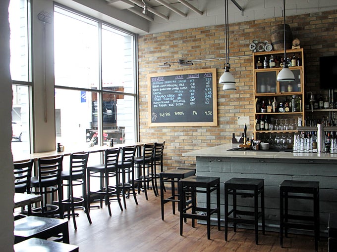 The bar area combines rustic charm with coastal cool, creating the perfect backdrop for seafood storytelling.
