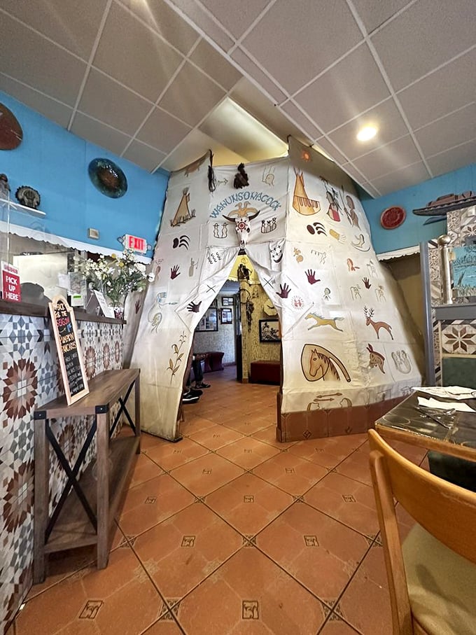 The teepee entrance isn't just quirky decor—it's a portal to pancake paradise, where calories don't count and maple syrup flows like liquid gold.