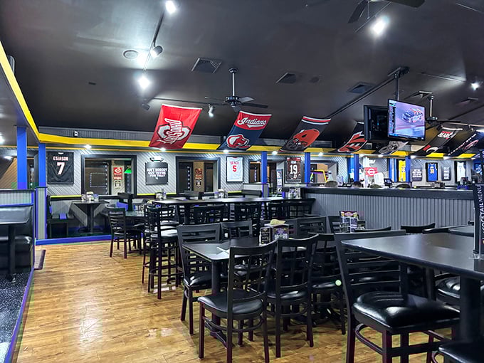 Sports memorabilia and team flags create the perfect backdrop for game day – where strangers become friends over touchdowns and good food.