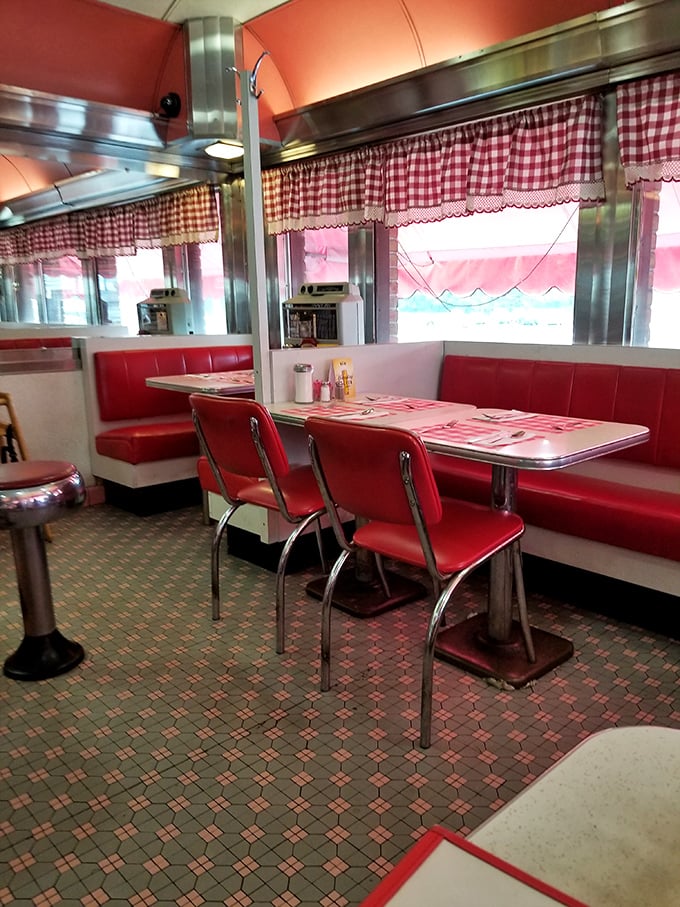 Red booths, chrome tables, and checkered curtains—the holy trinity of classic American diners where calories don't count and nostalgia flows freely.