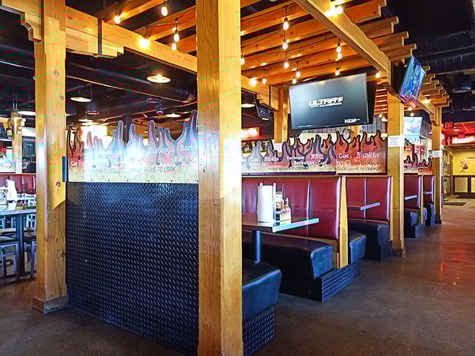 The booths aren't just seating – they're front-row tickets to the greatest meat show on earth, complete with flame décor.