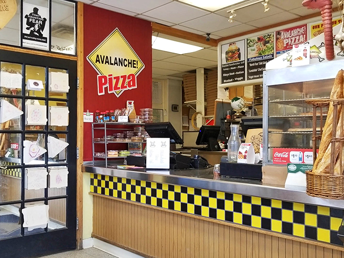 The checkered counter and wall of awards tell you everything—this isn't just pizza, it's pizza with credentials.
