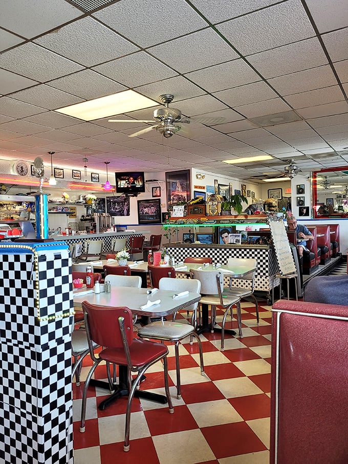 Every corner of this diner tells a story – from the ceiling fans to the checkered patterns that hypnotize you into ordering dessert.