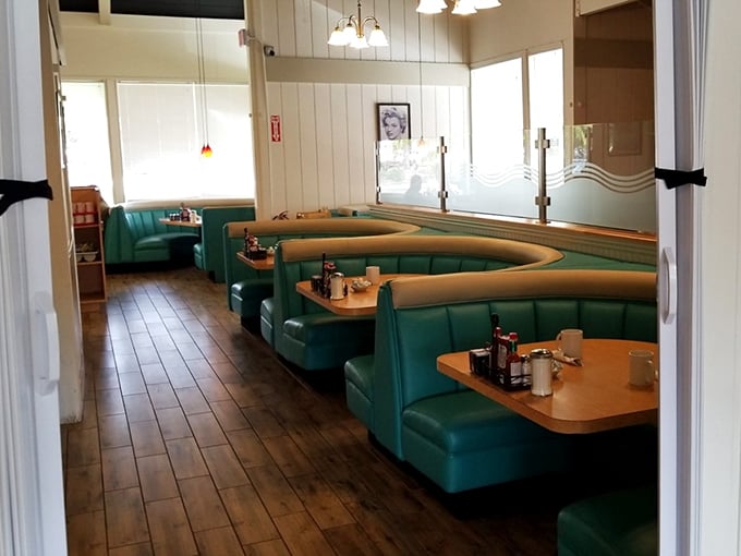 The turquoise booths aren't just seating – they're front-row tickets to the greatest show on earth: breakfast.