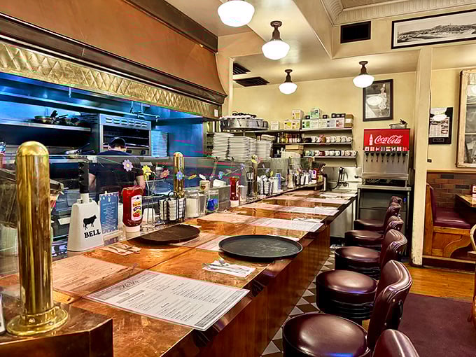 Counter seating: where breakfast voyeurs get front-row tickets to the griddle show. Those worn wooden surfaces have witnessed more breakfast epiphanies than a morning talk show.
