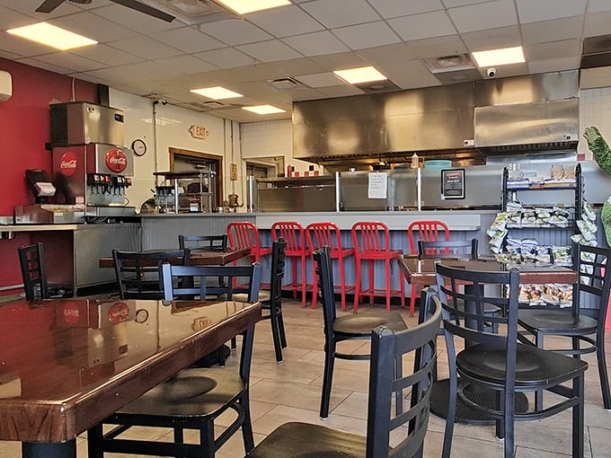 The open kitchen layout isn't just practical—it's dinner and a show, where sandwich artistry happens before your very eyes.