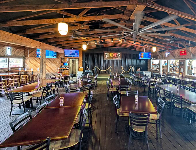 The dining room's exposed beams and weathered wood tell stories that the newest beach resort simply can't – authenticity you can actually feel.