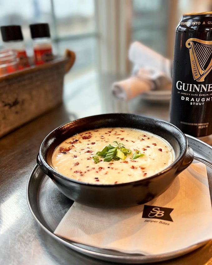 This isn't just potato soup—it's a warm hug in a bowl, especially when paired with that pint of Guinness standing guard nearby.