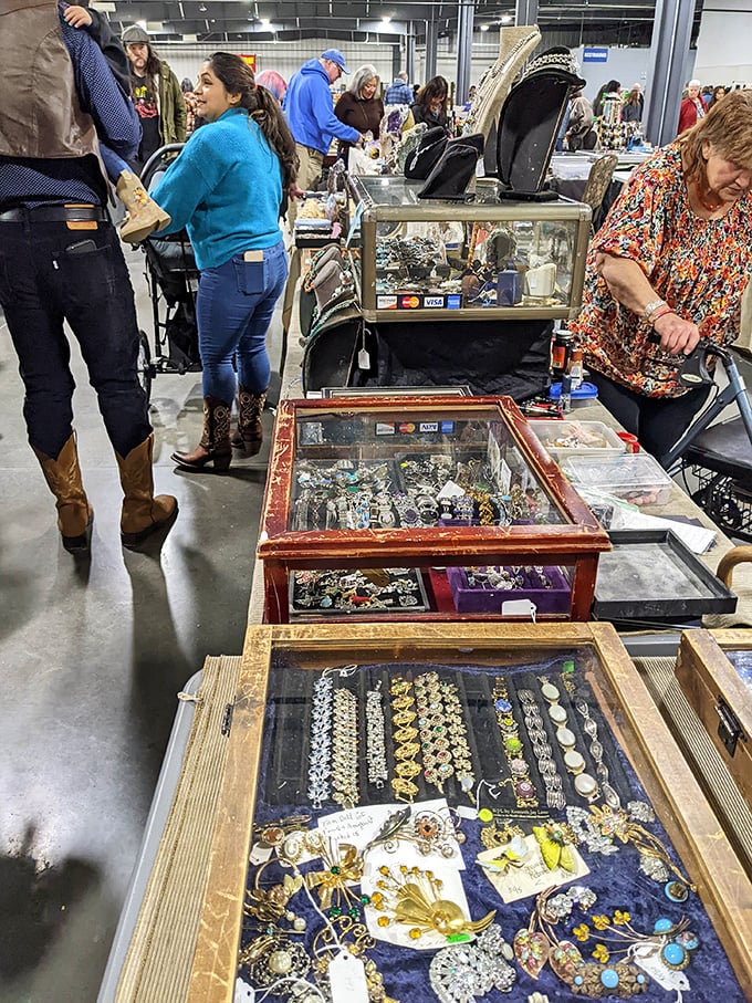 Jewelry cases glimmer with vintage brooches and necklaces – each piece waiting to complete an outfit or start a conversation at your next dinner party.
