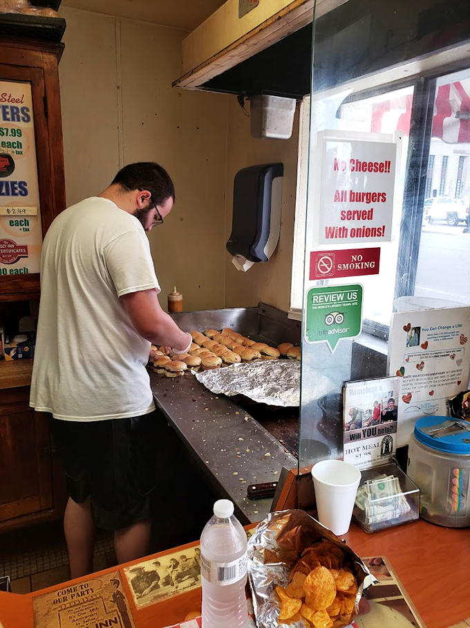 Behind the scenes where the magic happens—dozens of sliders in formation, awaiting their destiny on a well-seasoned grill.