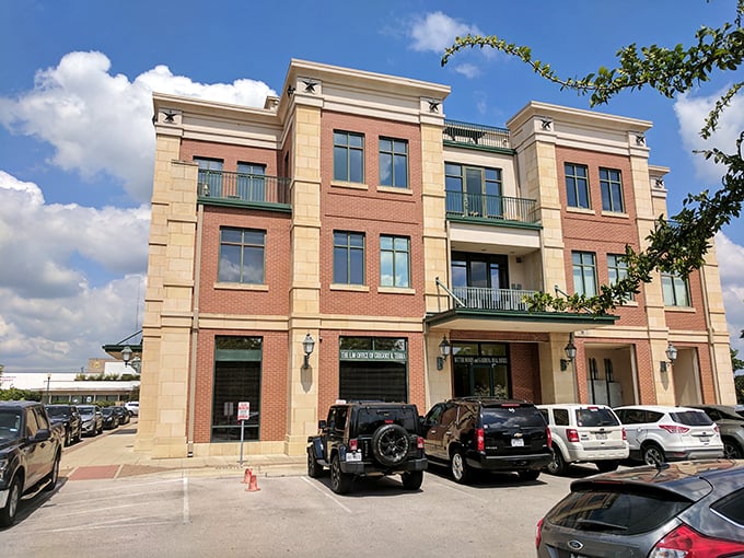 This mixed-use building blends brick, limestone, and modern design like a well-crafted cocktail—sophisticated yet approachable, just like Georgetown itself.
