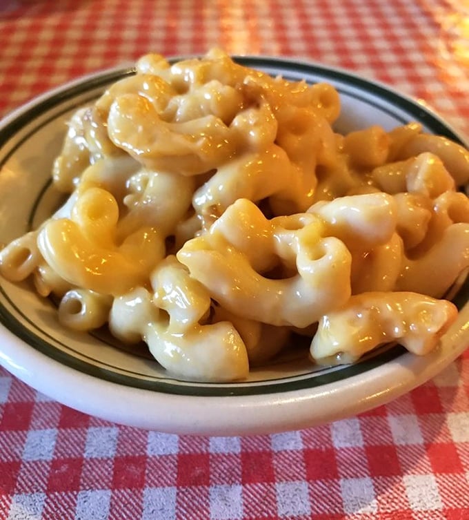 Mac and cheese that doesn't just sit on the plate—it beckons, it winks, it practically says "forget the diet, we're worth it."