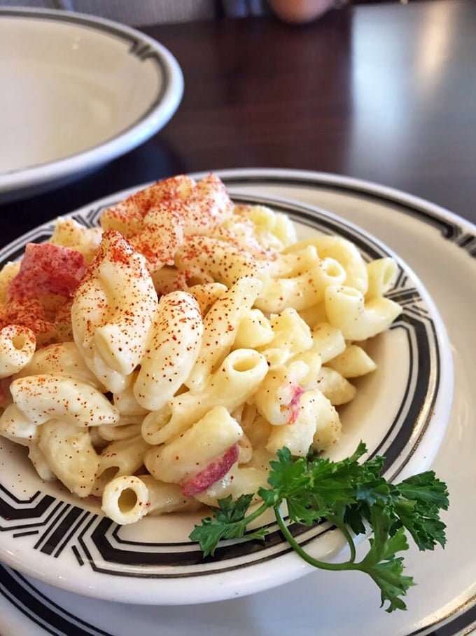 Mac and cheese that looks like it's been touched by angels. That dusting of paprika isn't just garnish—it's a promise.