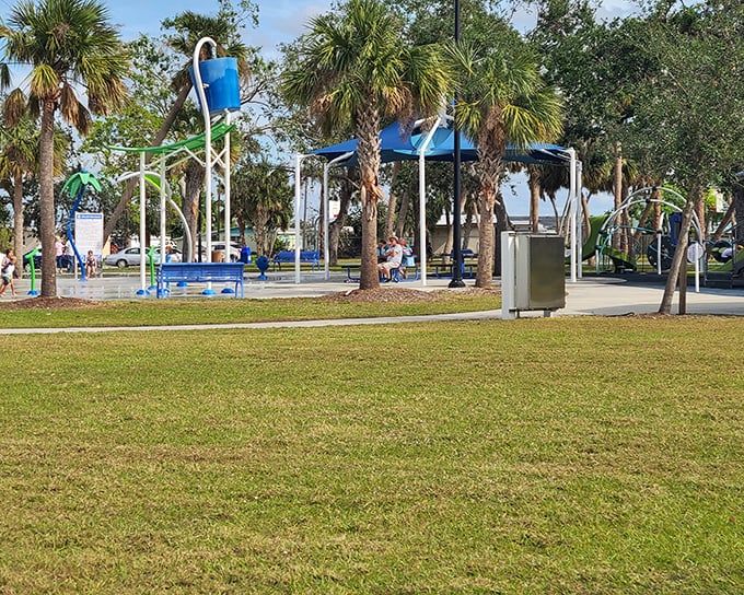 Kids' splash park where the soundtrack is pure joy – squeals of delight mixing with parents' sighs of "this was totally worth the sunscreen battle."