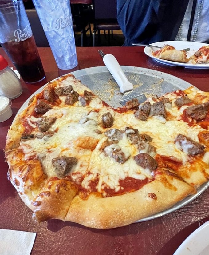 This meatball pizza doesn't just blur the line between two Italian classics – it erases it completely. The cheese pull potential here is magnificent.