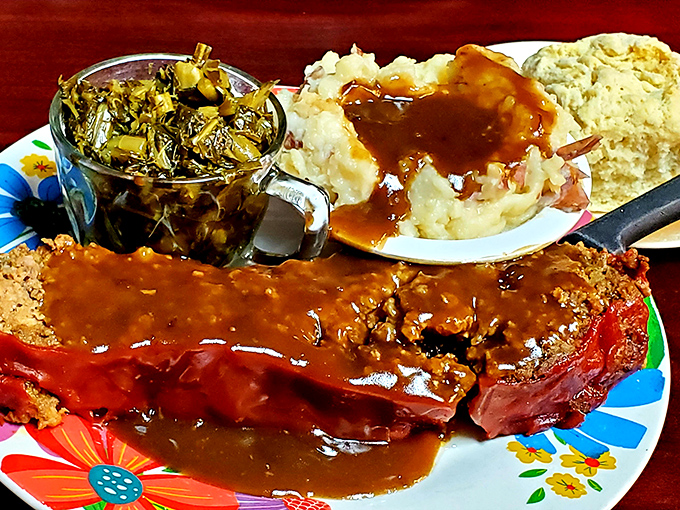 Meatloaf draped in rich gravy alongside mashed potatoes – the kind of plate that makes Monday feel like Sunday.