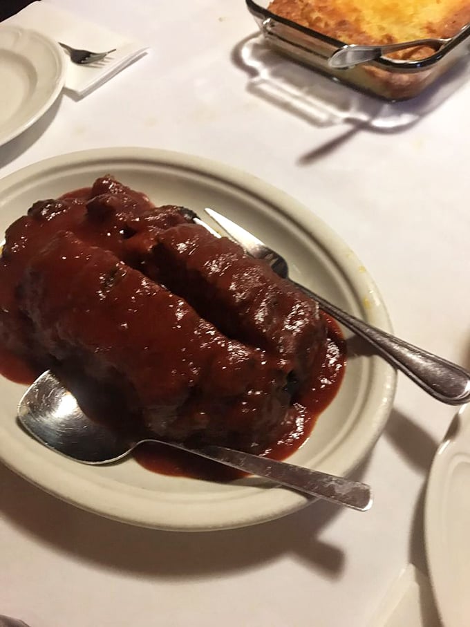 Meatloaf that doesn't apologize for being meatloaf. Smothered in tangy sauce, it's the comfort food equivalent of a warm hug from your favorite aunt.