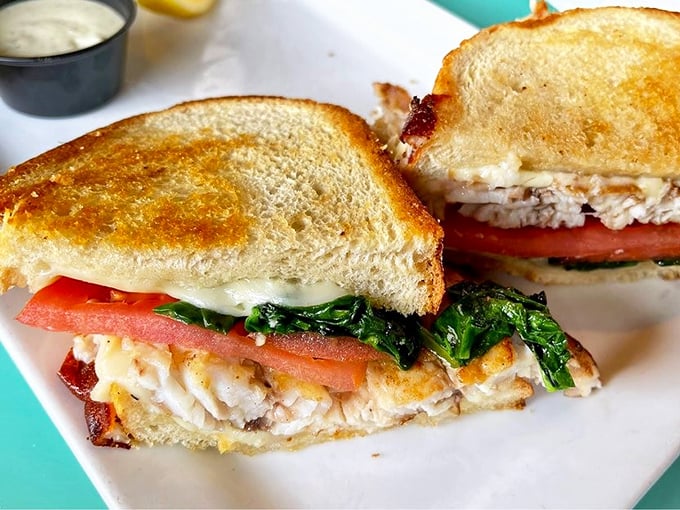 A fish sandwich that proves sometimes the best seafood experiences come between two slices of perfectly toasted bread.