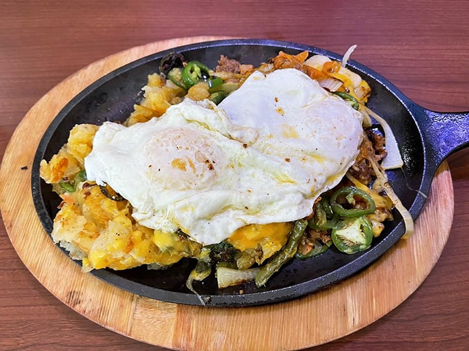 This sizzling skillet is what breakfast dreams are made of—eggs, potatoes, and veggies performing a perfect harmony under melted cheese.