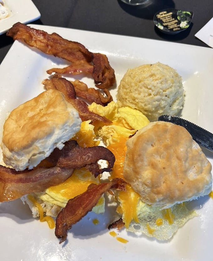 Biscuits, eggs, and bacon arranged with the care of a still-life painting, except this masterpiece is meant to be devoured.