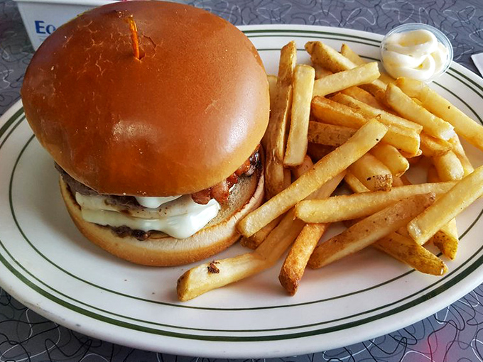 This isn't just a burger—it's a masterpiece of melty cheese, perfectly seasoned beef, and a bun that's somehow both substantial and cloud-soft.